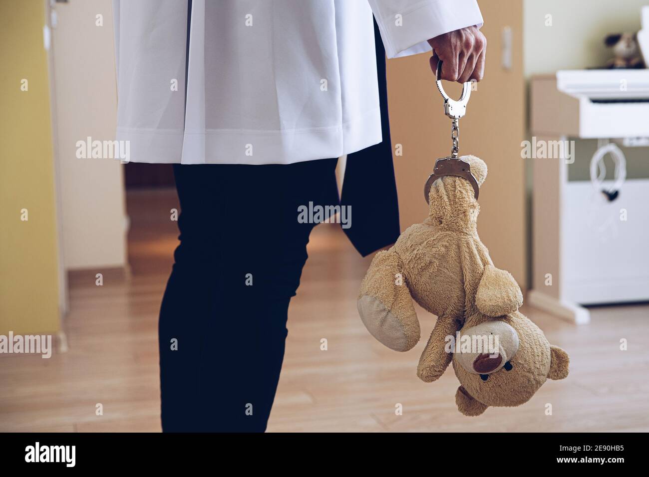 Priest holding child plush toy teddy bear Stock Photo - Alamy