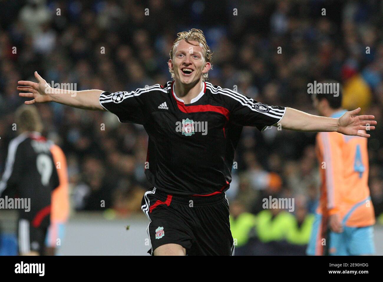 Liverpool's Dirk Kuyt scores and celebrates during the UEFA Champions ...