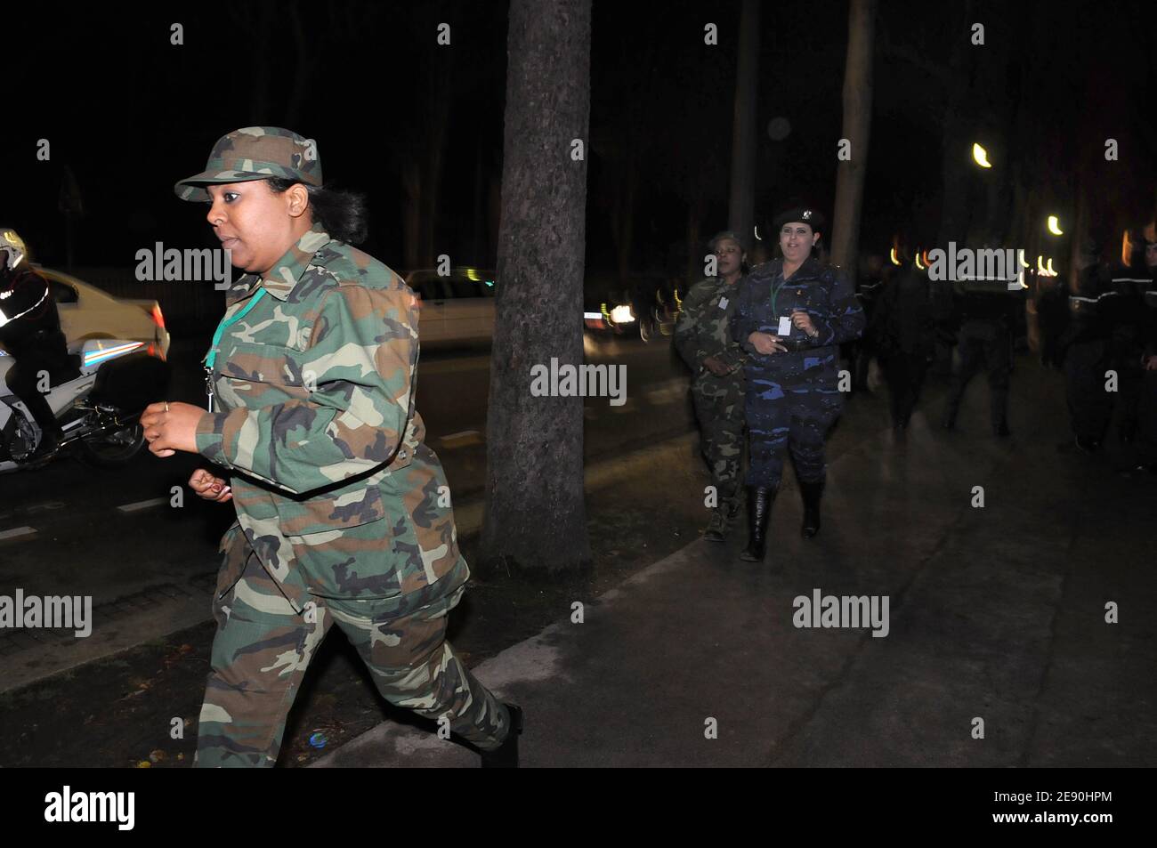 Libyan female bodyguards "amazone" run next to leader Moammar Gadhafi's ...
