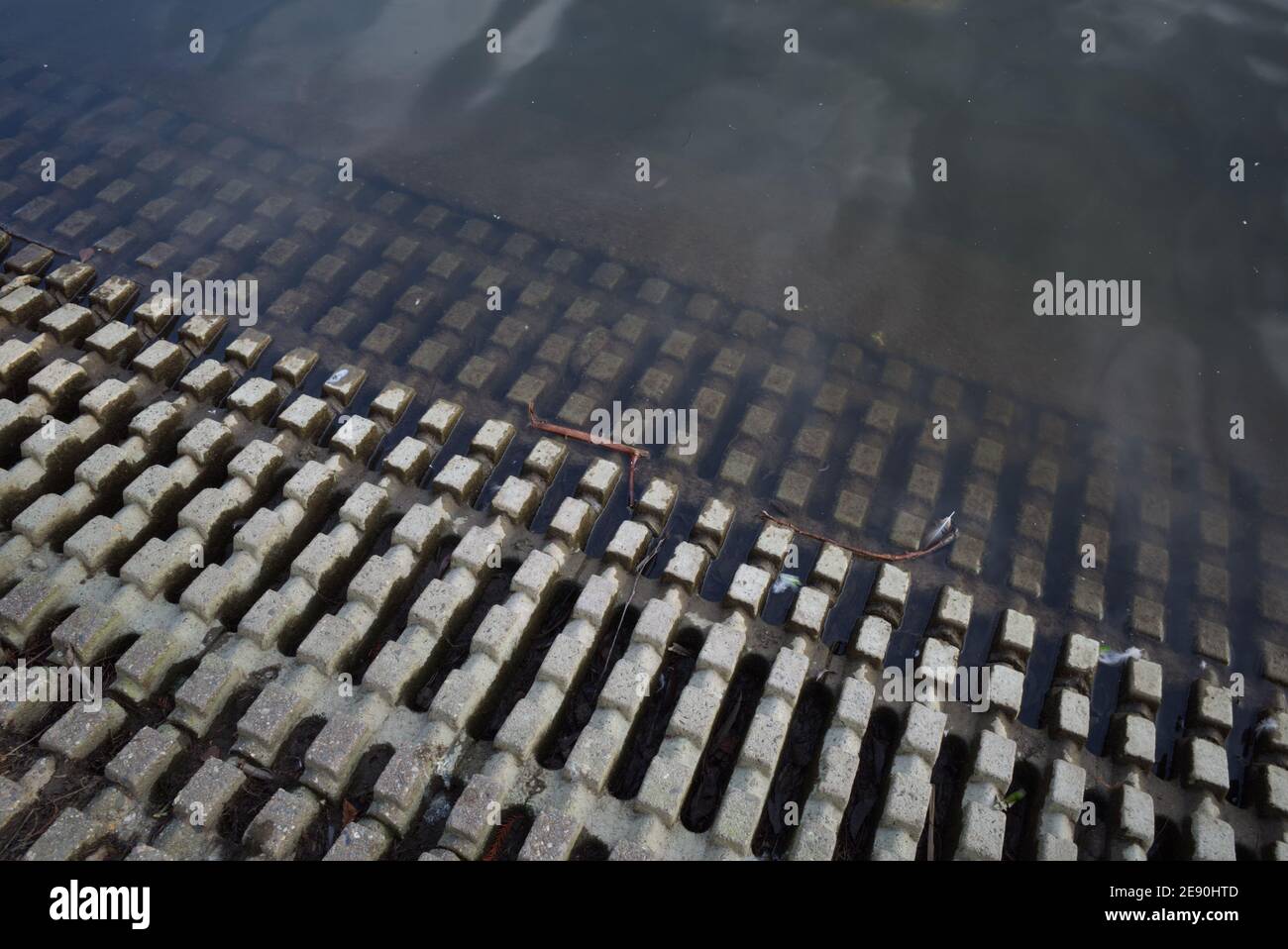 Top view, close-up detail of concrete graded access to the water or ...