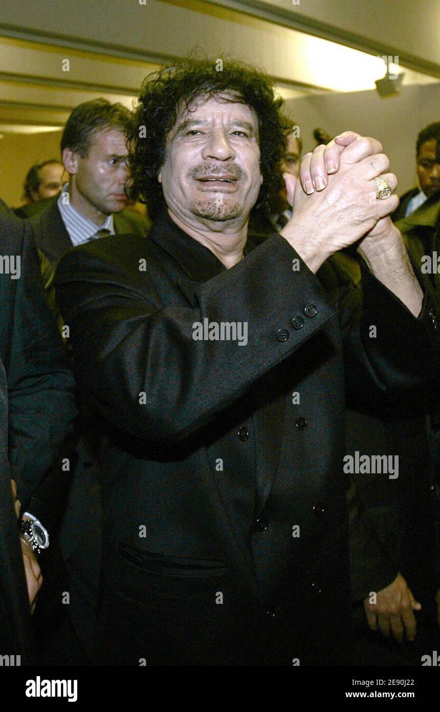 Libyan leader Moammar Gadhafi looks on as he delivers a speech at the ...