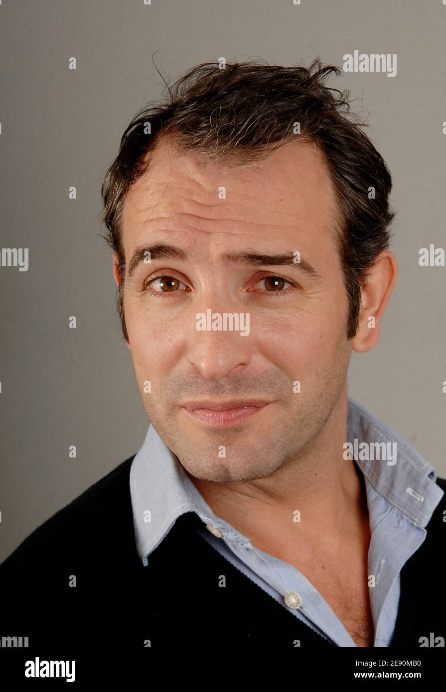 French actor Jean Dujardin poses for our photographer with his trophy ...