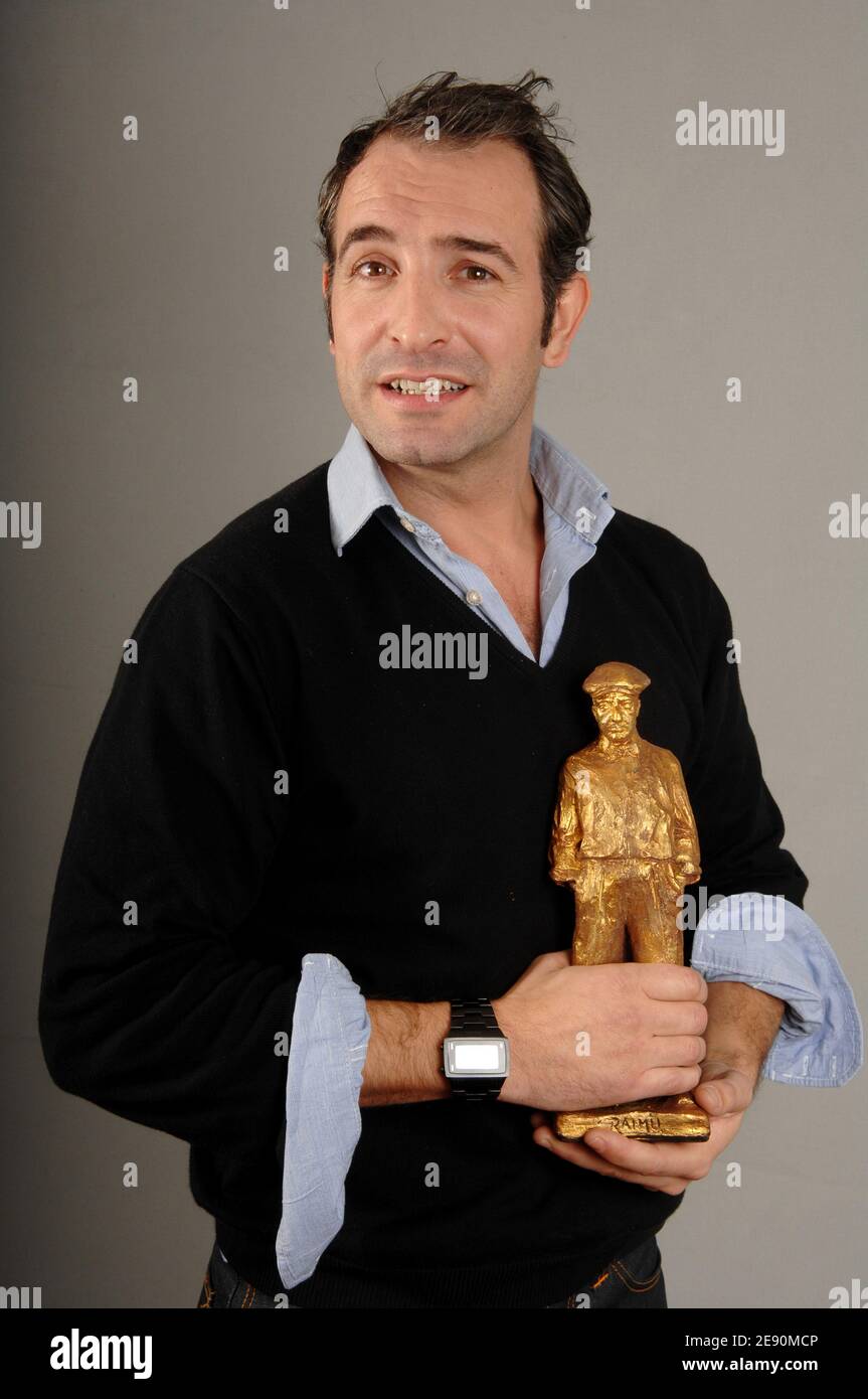 French actor Jean Dujardin poses for our photographer with his trophy ...