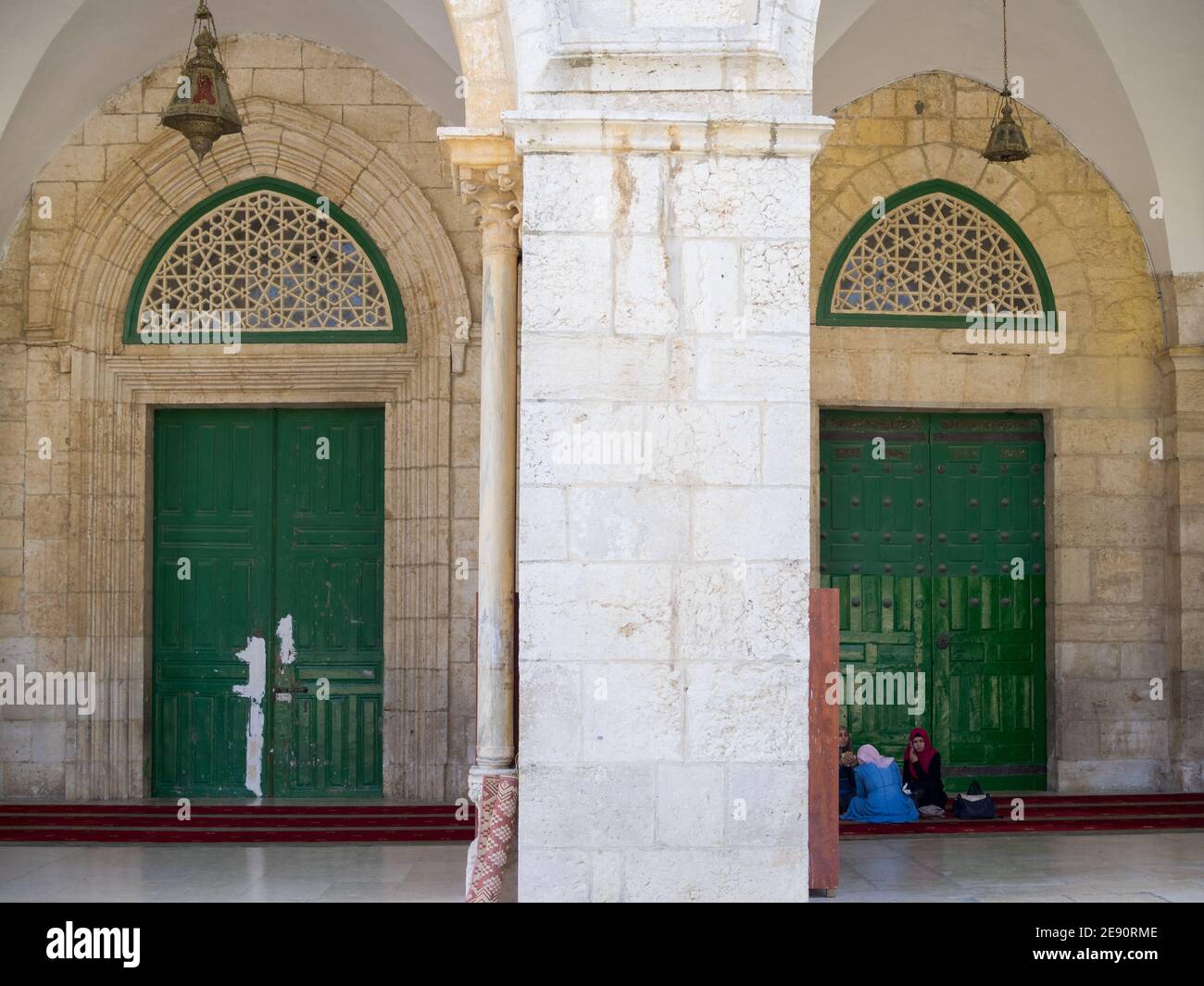 Muslim women talking under the arcade of Al-Aqsa Mosque Stock Photo - Alamy