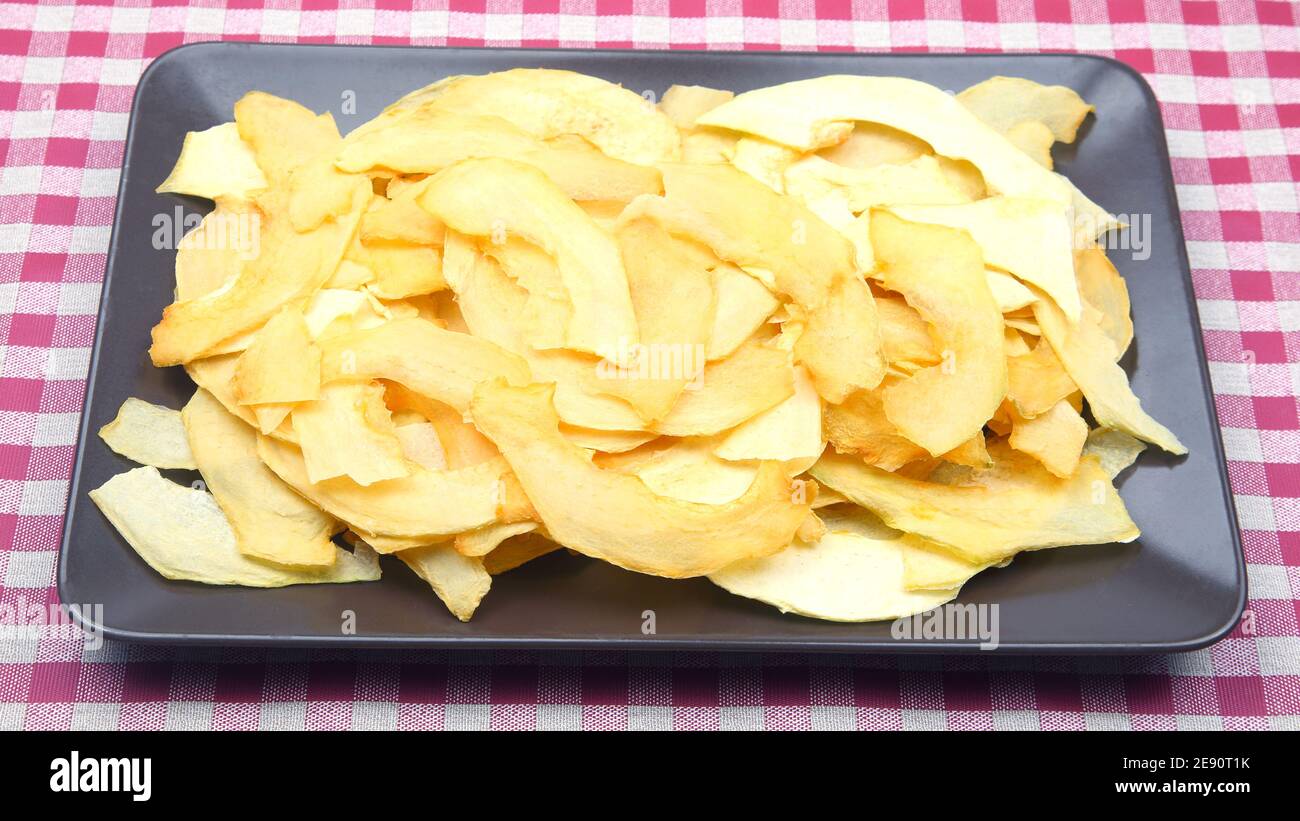dried pieces of fragrant melon on a plate. vitamin fruit food Stock ...