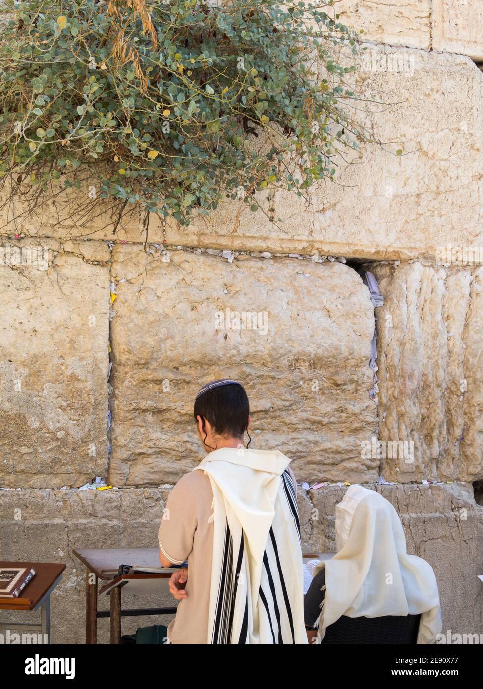 Jewish men in traditional costume reading the Torah by the Western Wall ...
