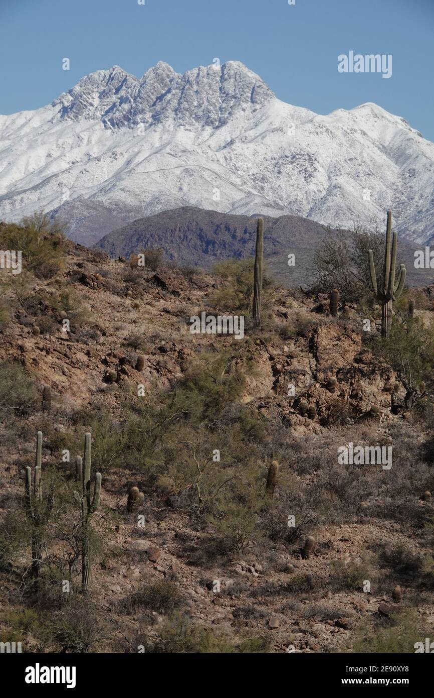 A winter storm covers the Four Peaks Mountains in snow in the Arizona ...