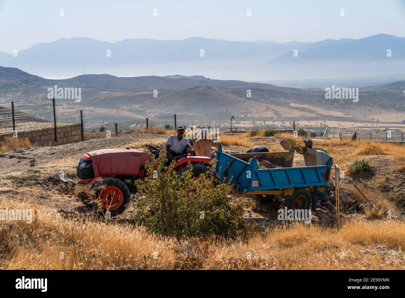 Man carrying heavy rock hi-res stock photography and images - Alamy