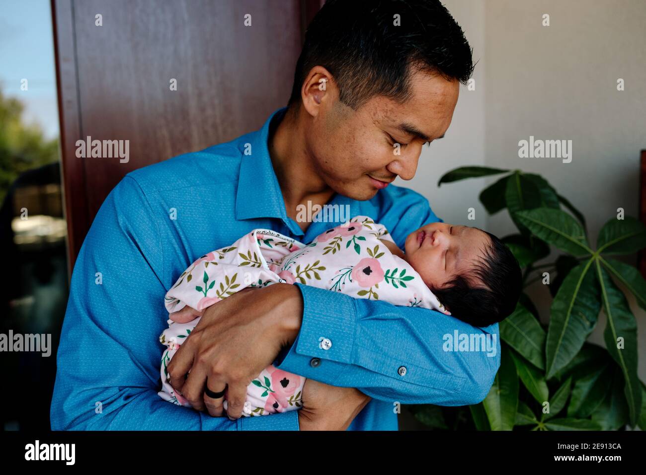 Baby sleeping in father arms hi-res stock photography and images - Alamy