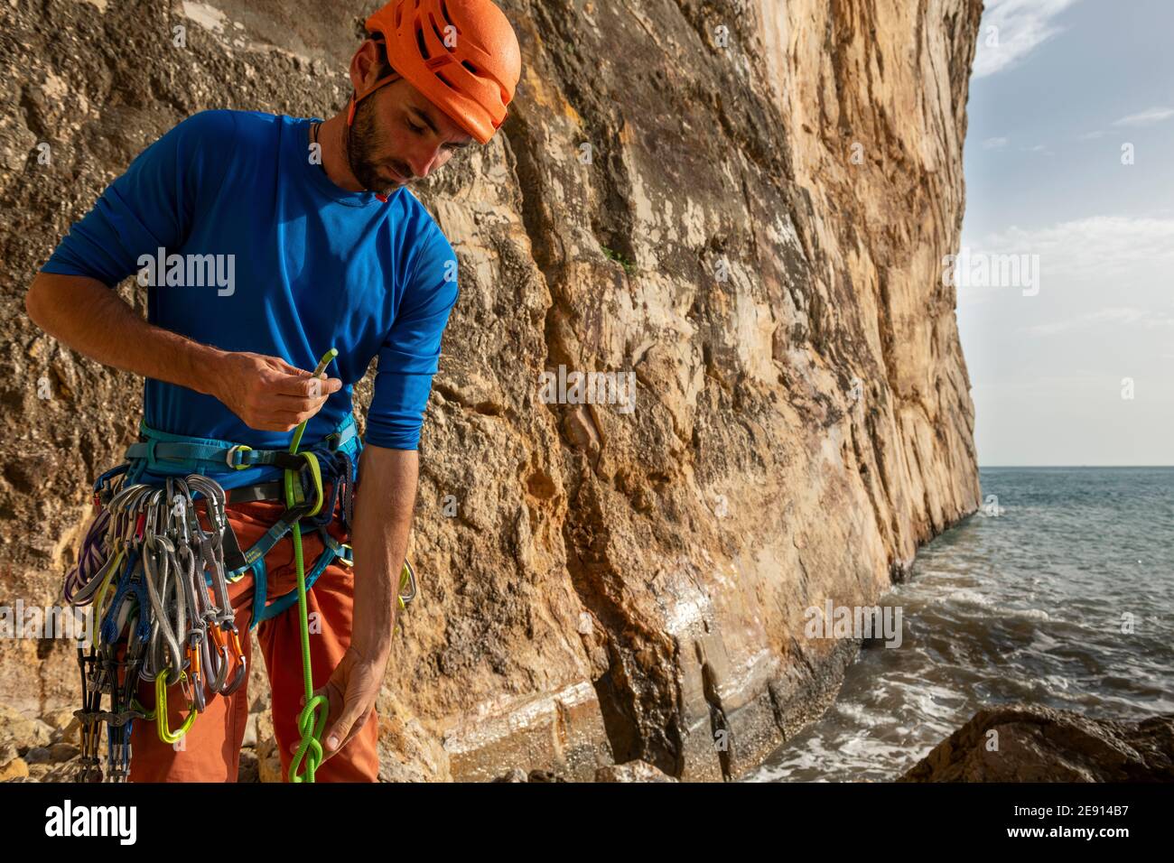 Getting ready to climb in Raco del Corv cove, Toix mountain, Calpe ...