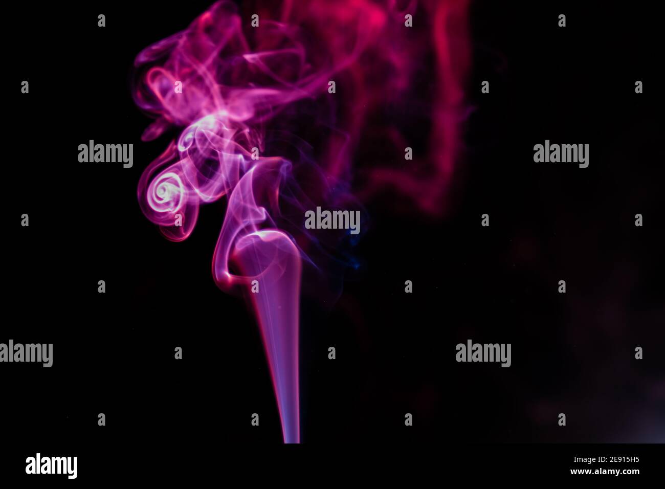 random shapes of colored smoke fired with colored flash Stock Photo - Alamy