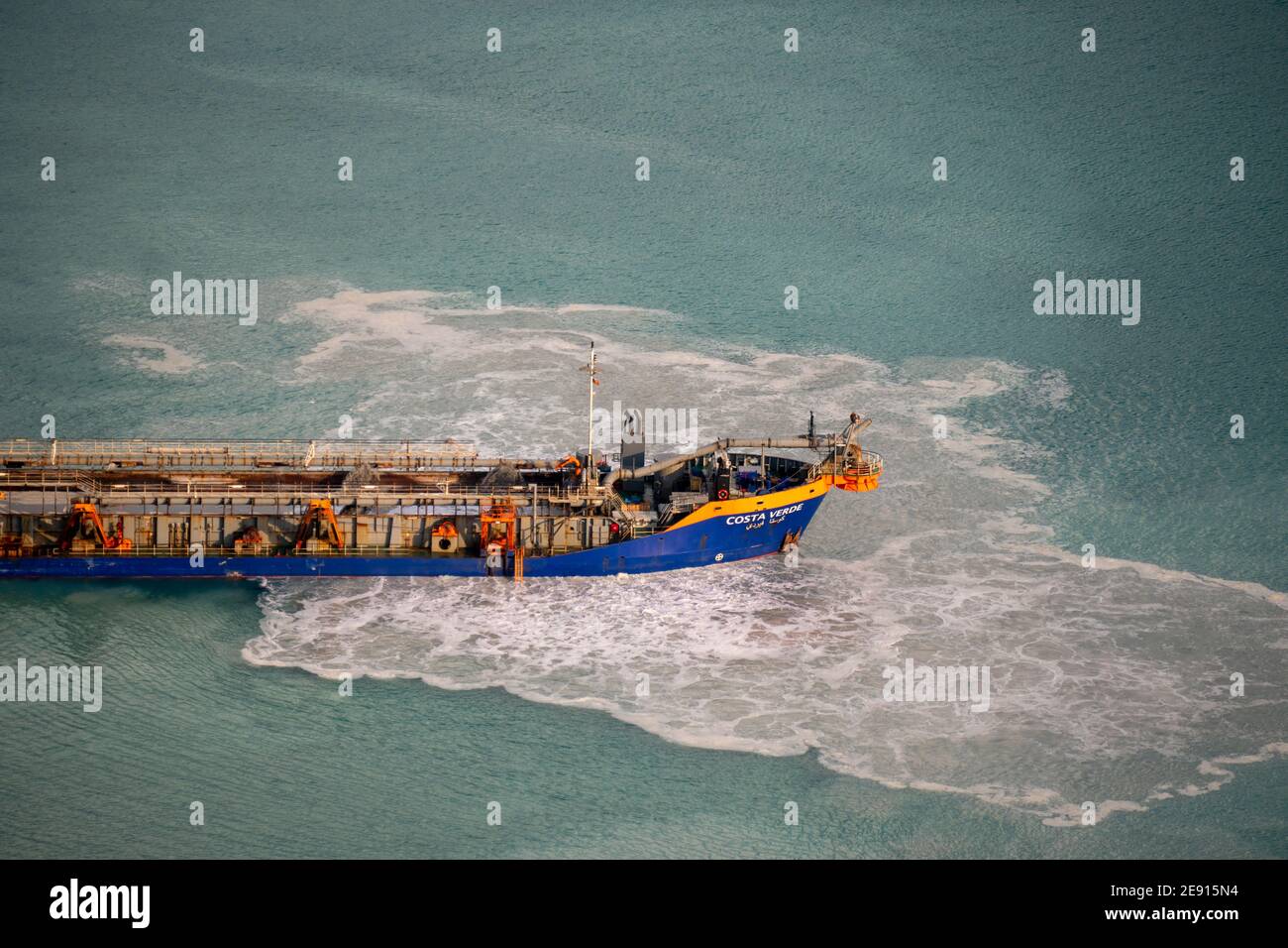 Suction Dredger Emptying Sluices, Spoiling Water of Gulf with mud Spot ...