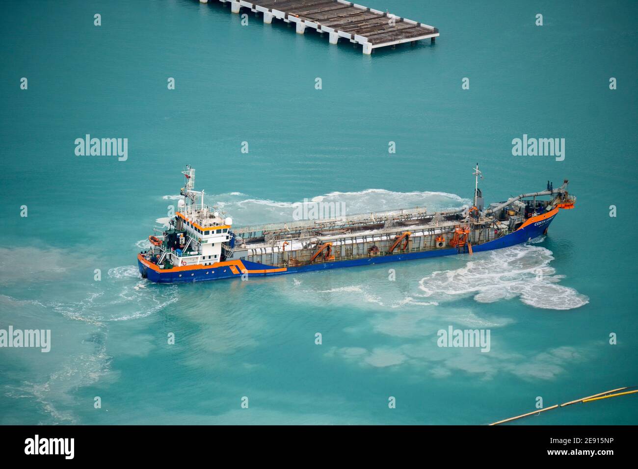 Suction Dredger Emptying Sluices, Spoiling Water of Gulf with mud Spot ...