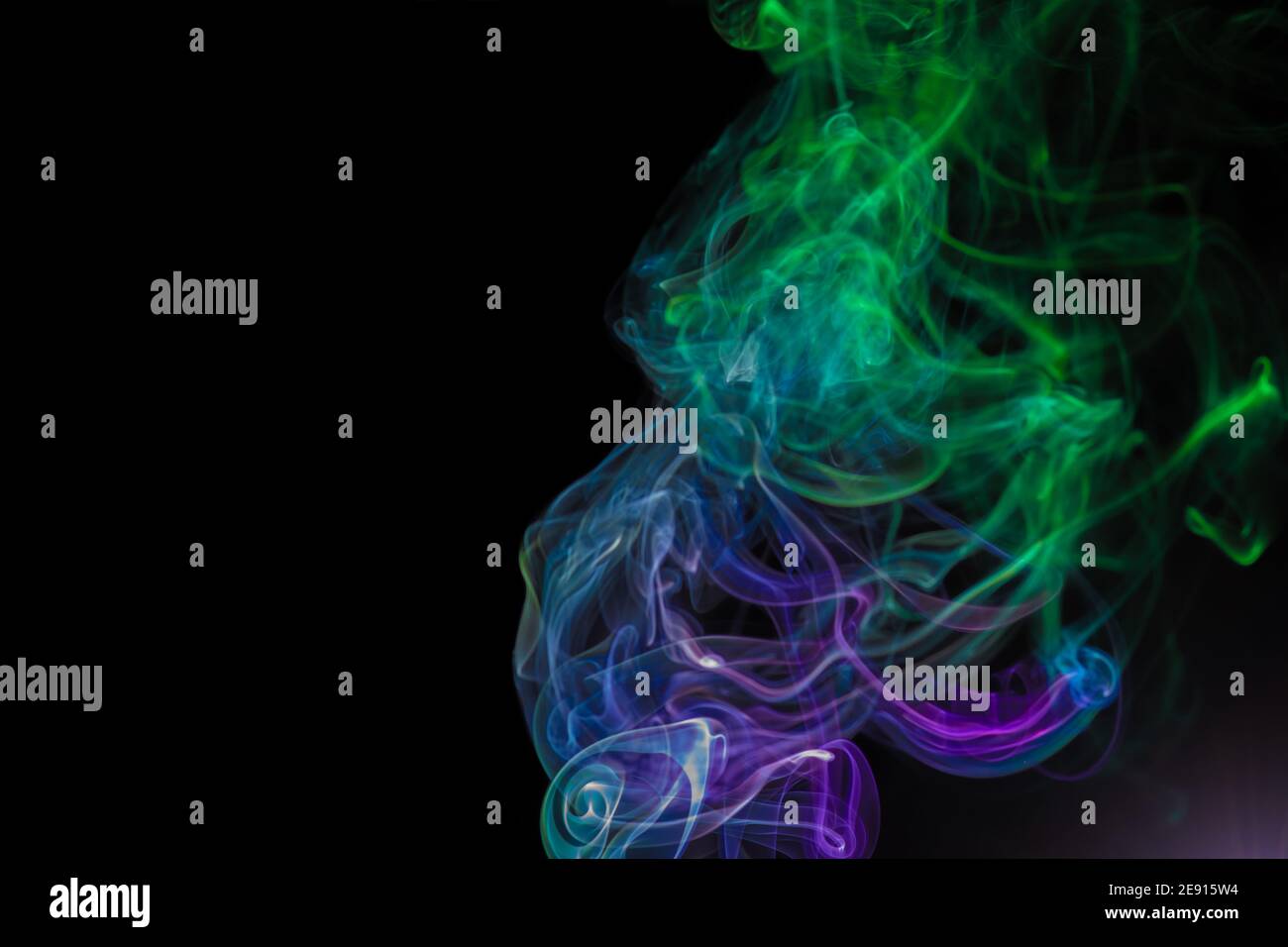 random shapes of colored smoke fired with colored flash Stock Photo - Alamy