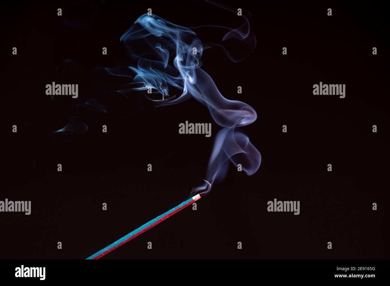 random shapes of colored smoke fired with colored flash Stock Photo - Alamy