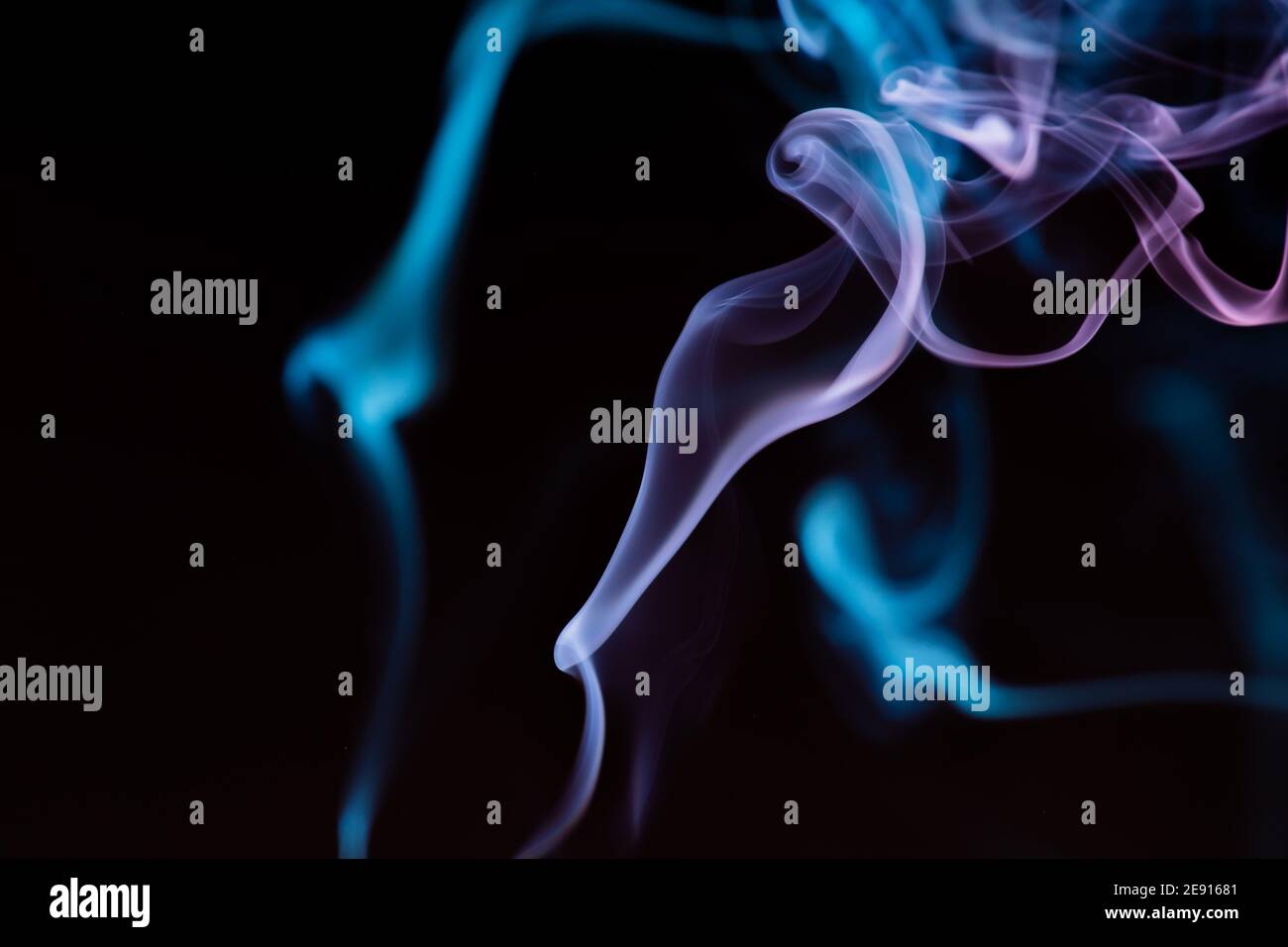 random shapes of colored smoke fired with colored flash Stock Photo - Alamy