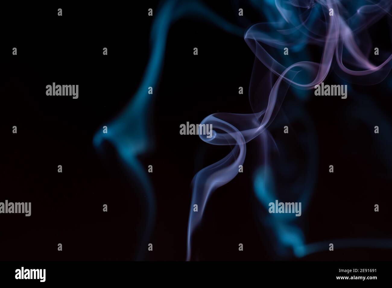 random shapes of colored smoke fired with colored flash Stock Photo - Alamy