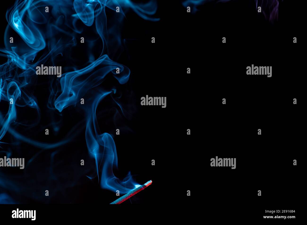 random shapes of colored smoke fired with colored flash Stock Photo - Alamy