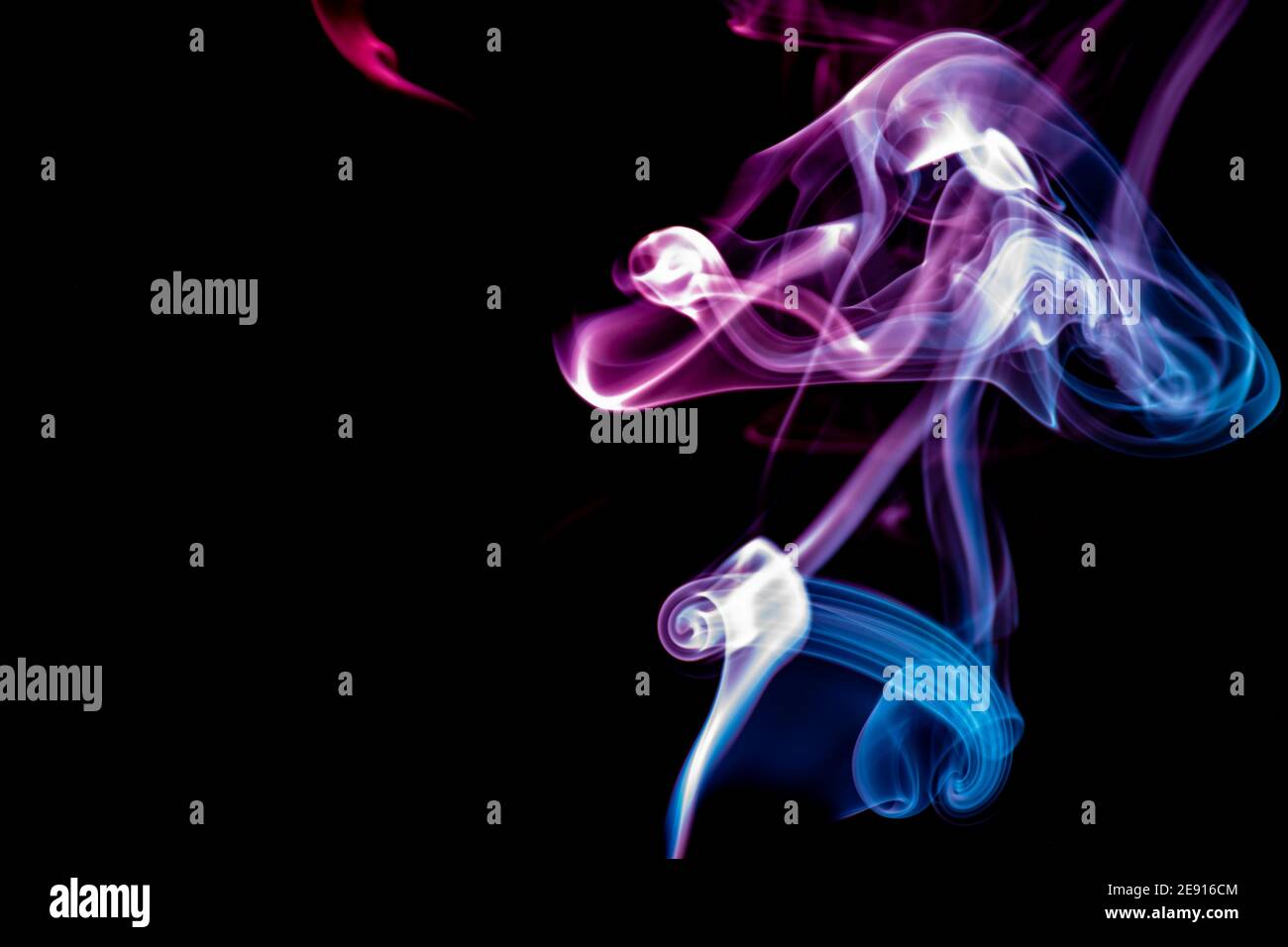 random shapes of colored smoke fired with colored flash Stock Photo - Alamy
