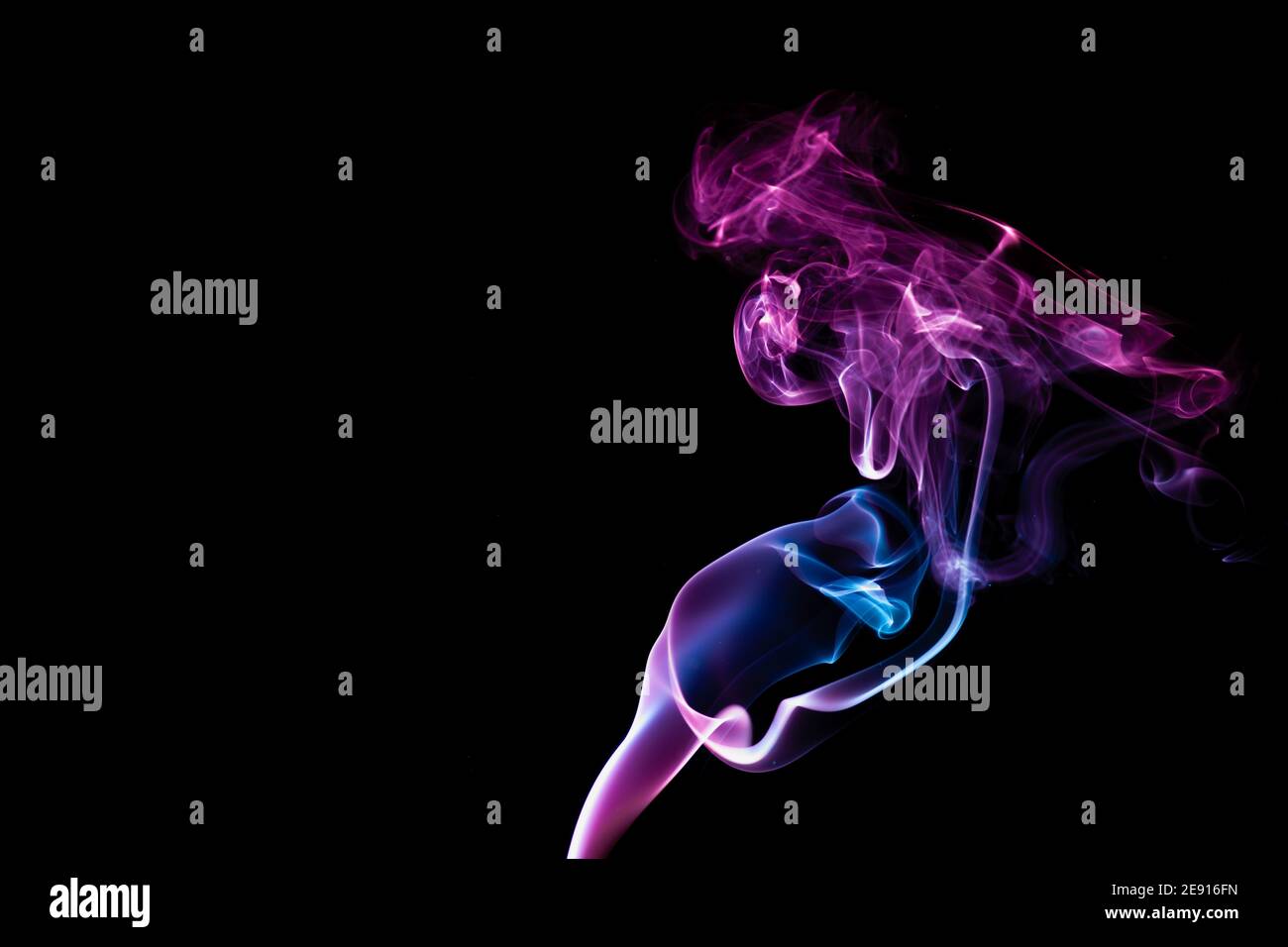 random shapes of colored smoke fired with colored flash Stock Photo - Alamy