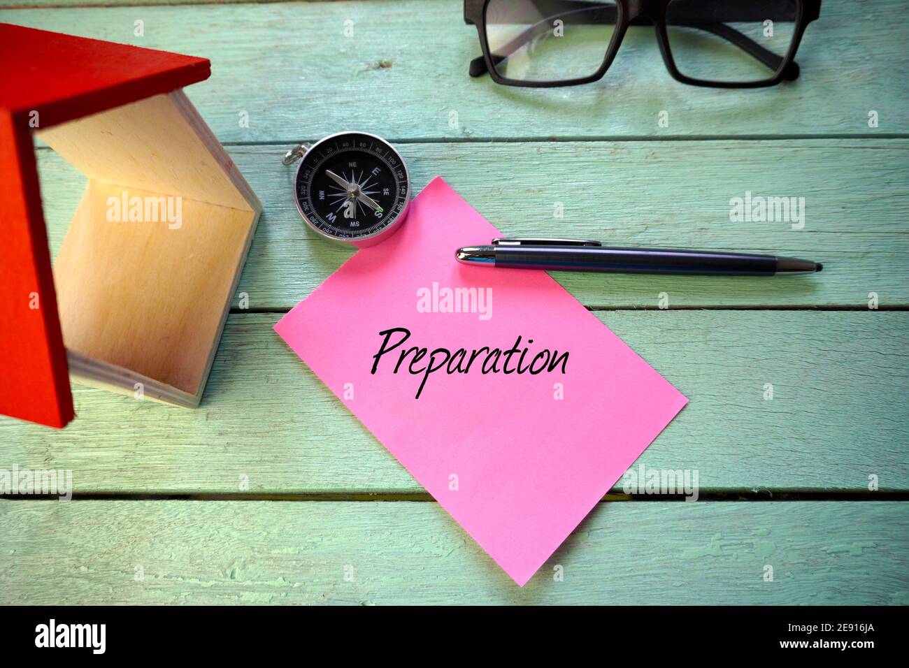Preparation inscription written on the sticky note Stock Photo - Alamy
