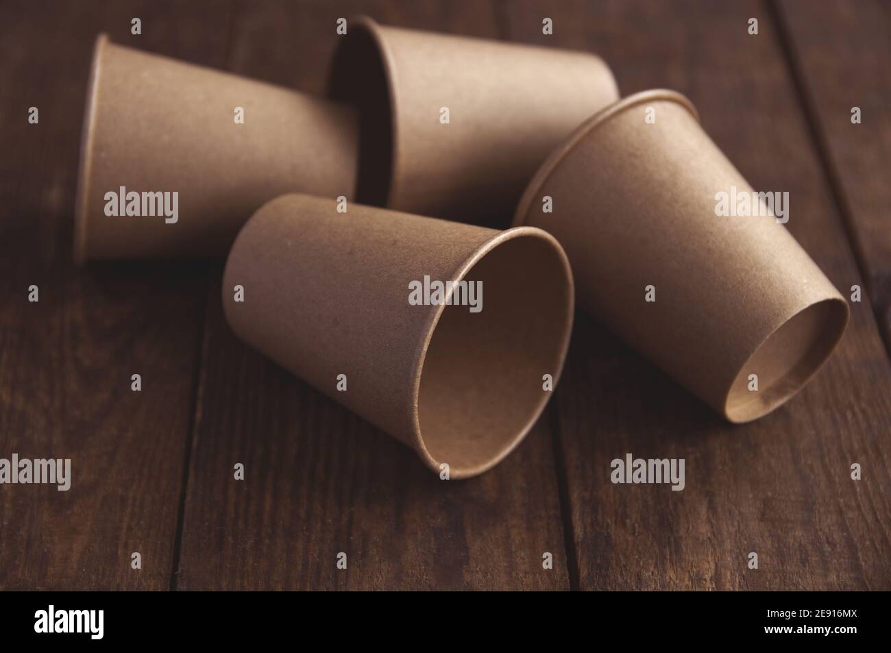 ecological kraft paper cups for coffee and tea dark brown on the table ...