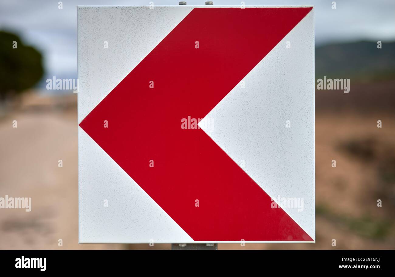 detail of a traffic sign with a red arrow indicating a curve Stock ...