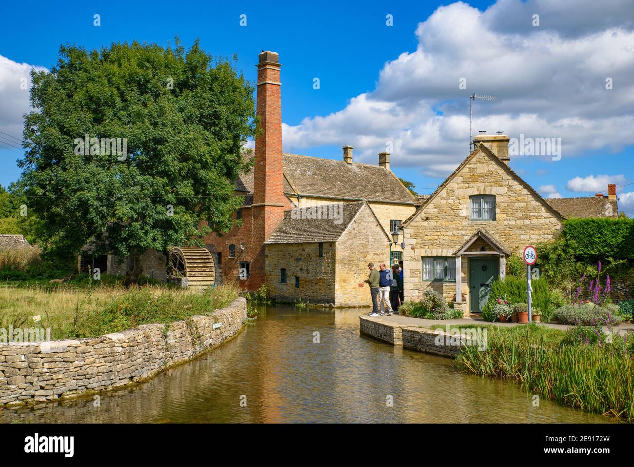 Old water mill in Lower Slaughter, a village in Cotswolds area, England ...