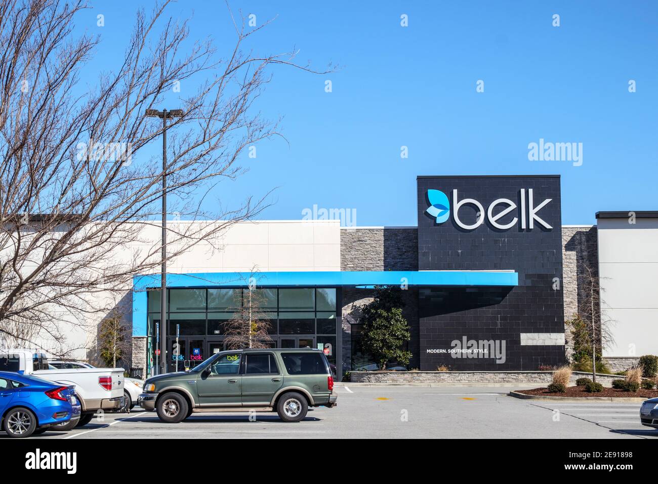 Augusta, Ga USA - 01 28 21: Belk retail store people and cars with blue ...