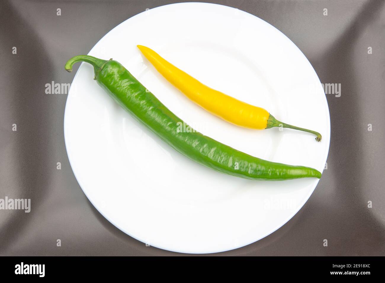 yellow and green hot chili on a plate. Pepper. Vegetable vitamin food ...