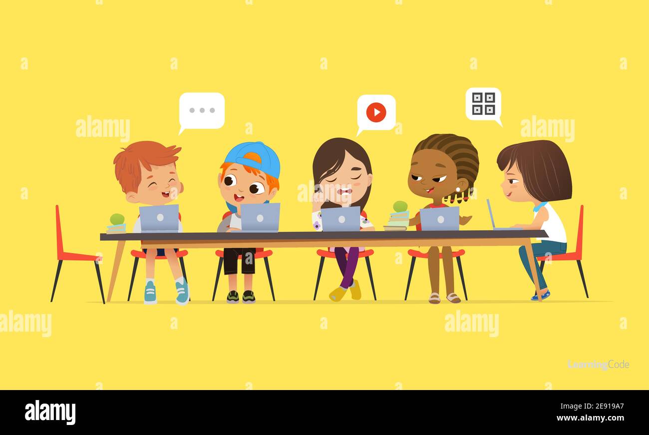 Happy children sitting at laptops and learning programming during ...