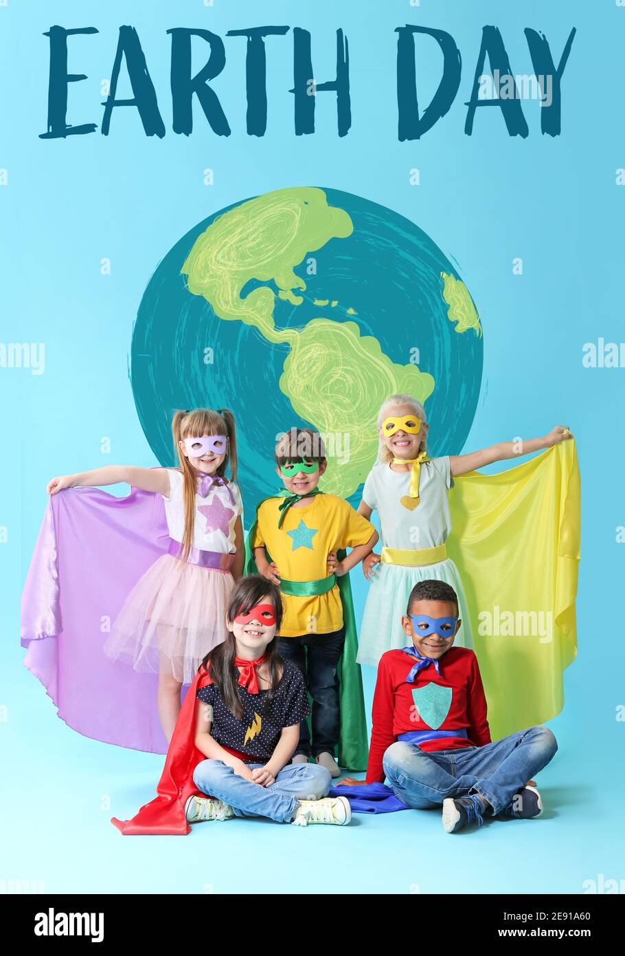 Cute little children dressed as superheroes near drawing of planet on ...