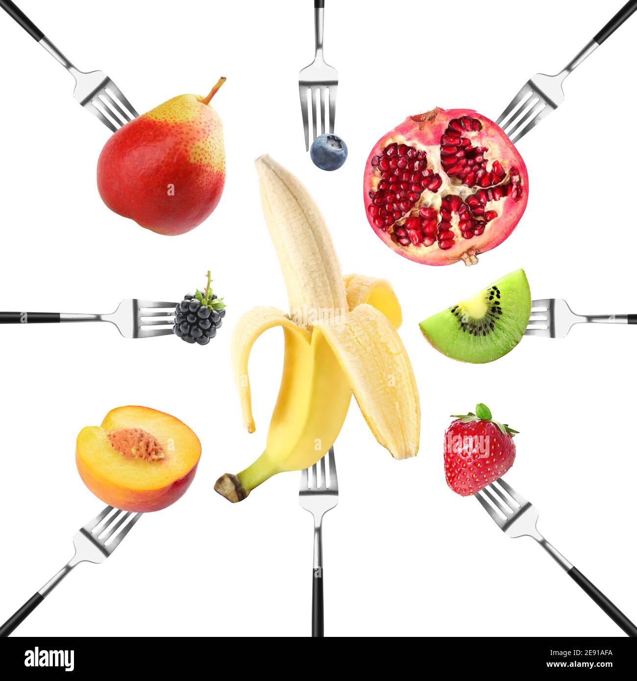 Different fruits impaled on forks against white background Stock Photo ...