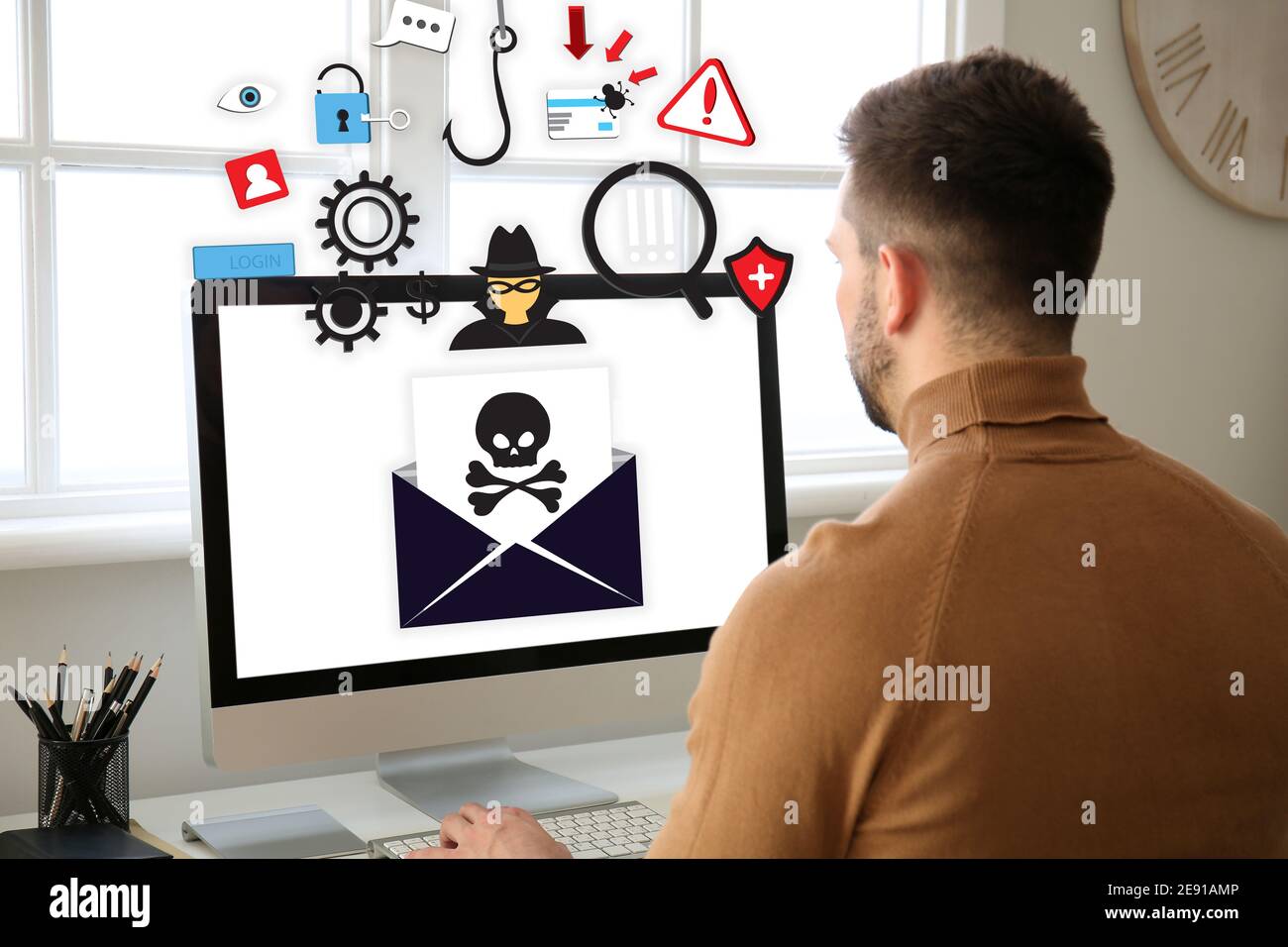 Young man with received infected email message on screen of computer at ...