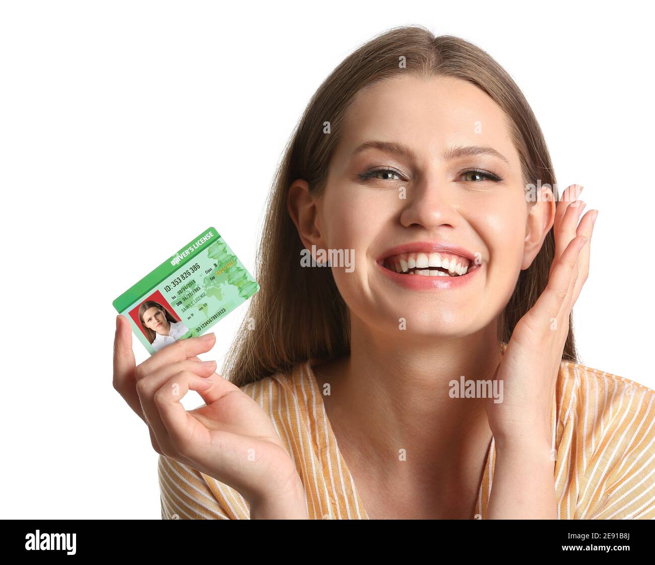 Happy young woman with driving license on white background Stock Photo ...