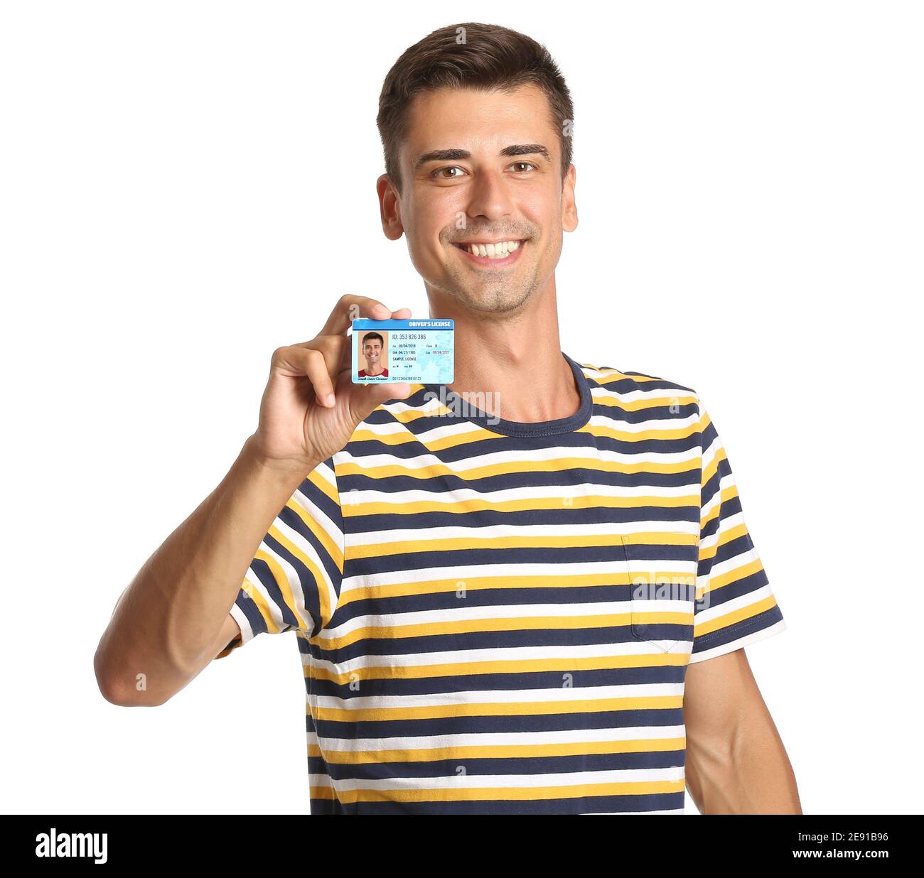 Happy young man with driving license on color background Stock Photo ...