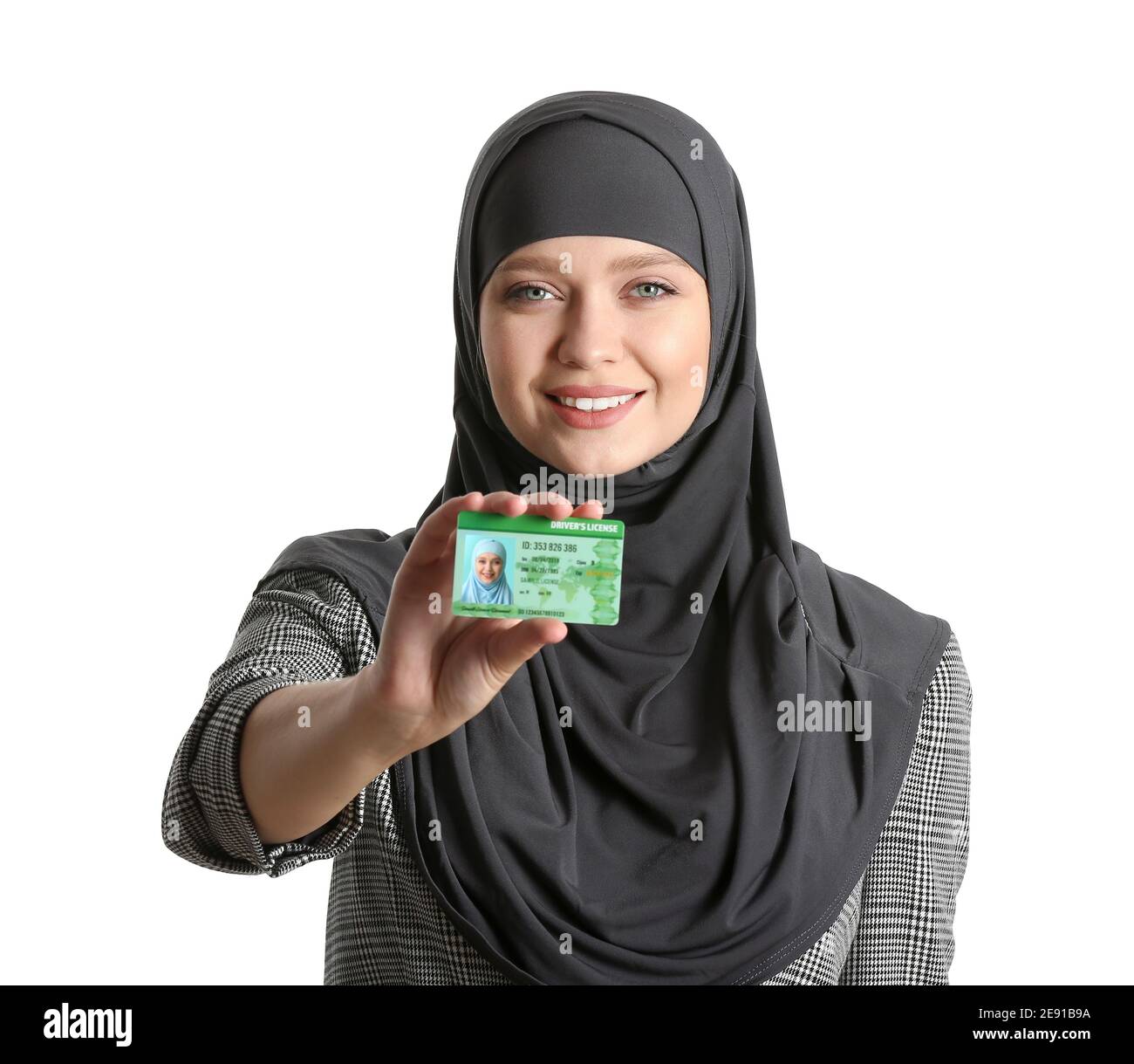 Happy Muslim woman with driving license on white background Stock Photo ...