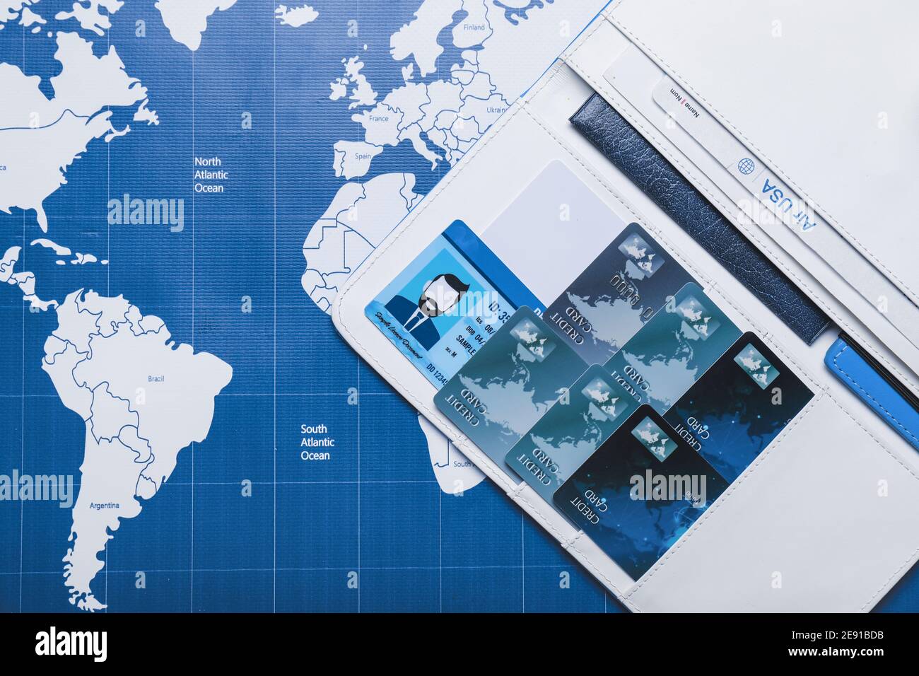 Travel organizer with different things on world map Stock Photo - Alamy