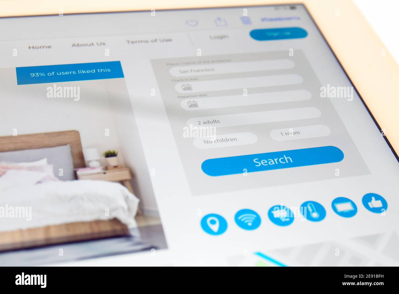 Open page of online booking service on screen of tablet computer ...