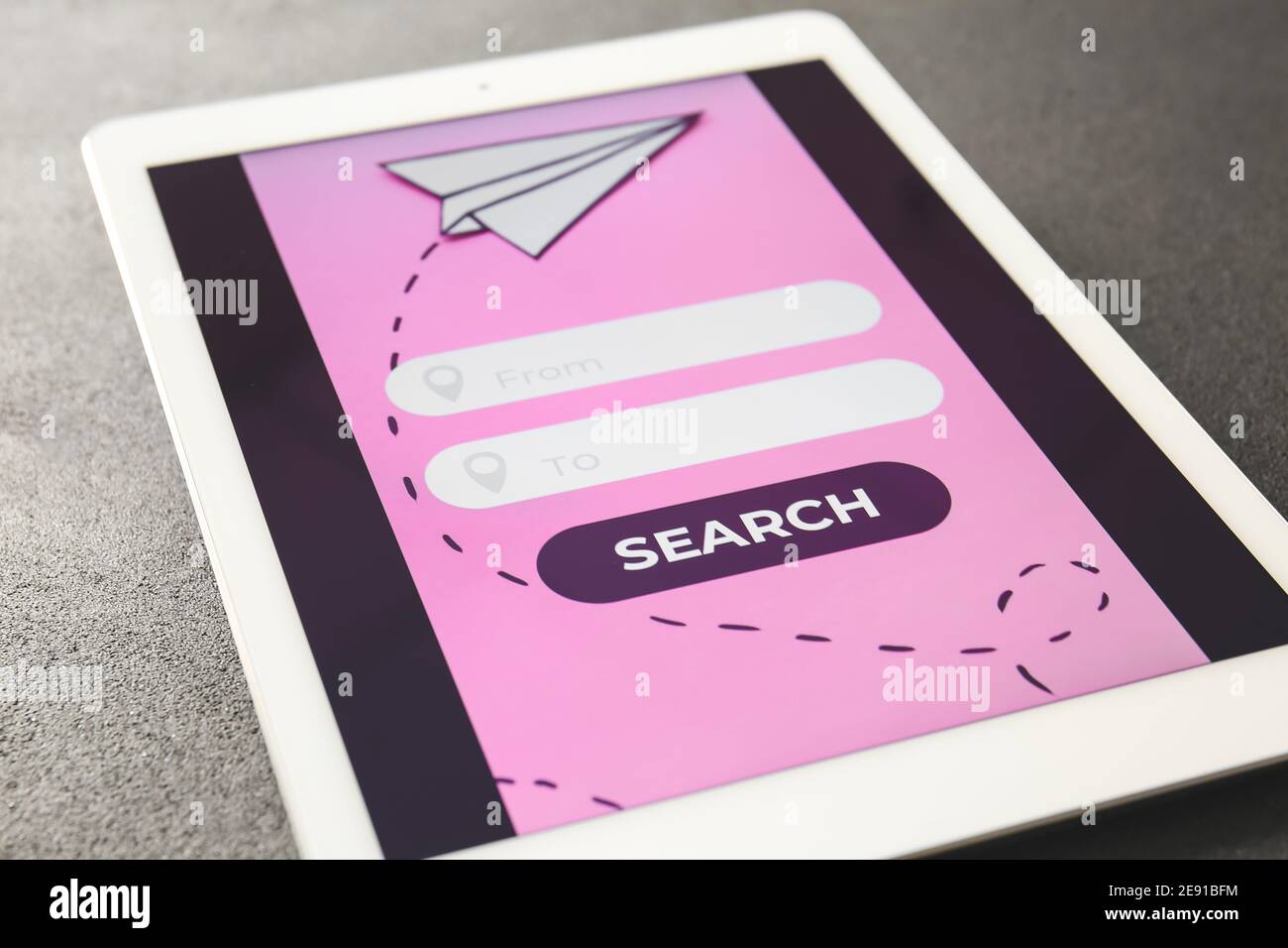 Open page of online booking service on screen of tablet computer on ...