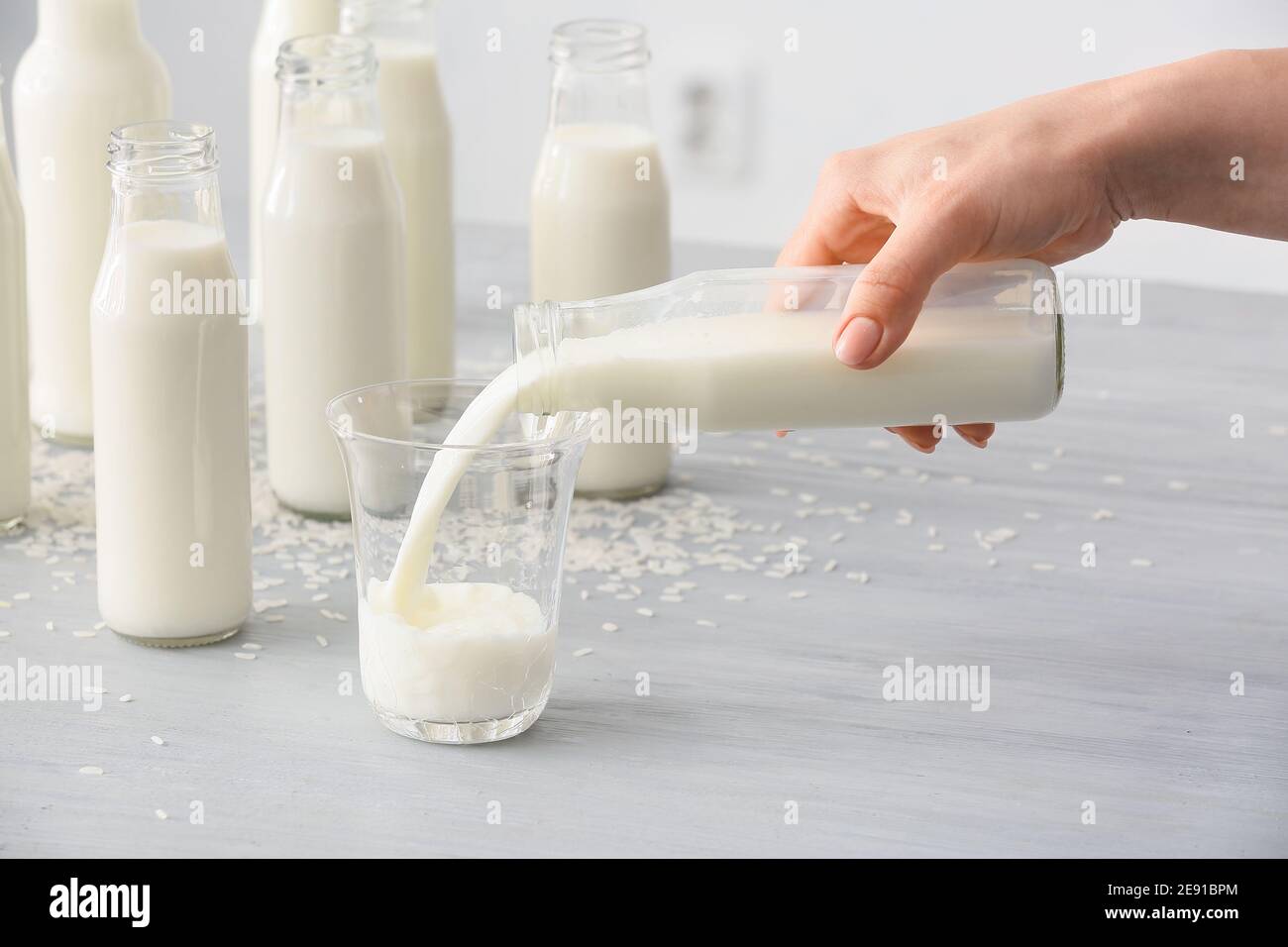 Woman pouring rice hi-res stock photography and images - Alamy
