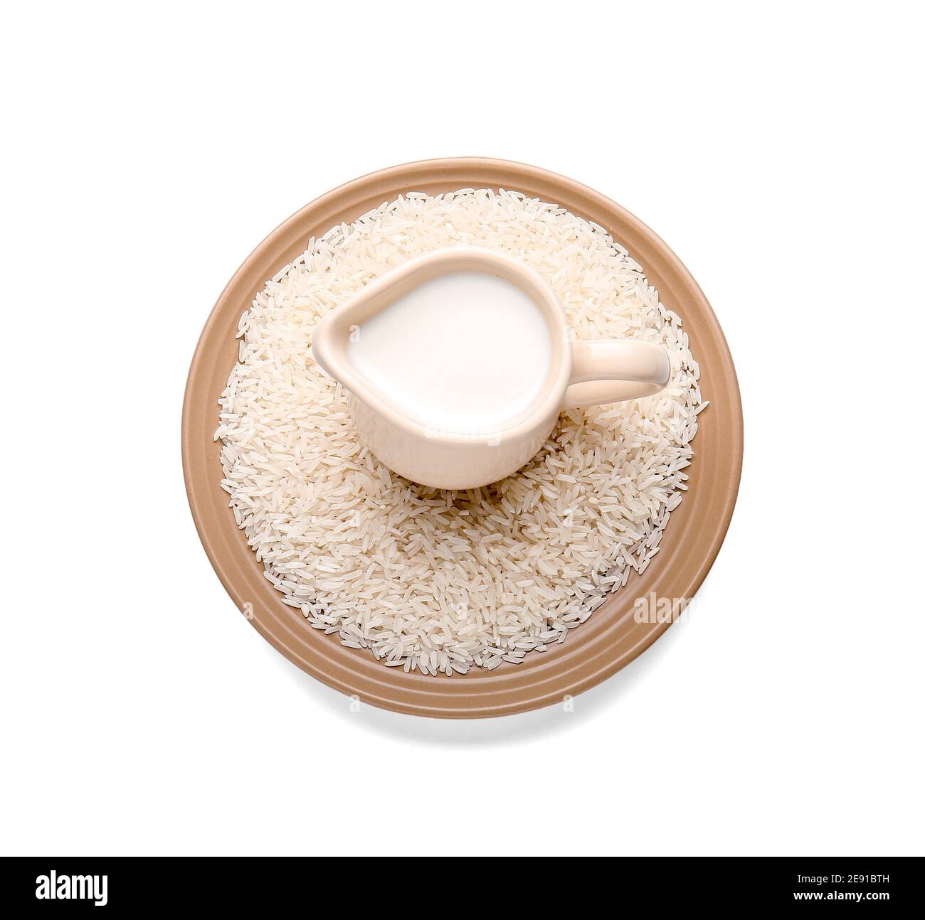Jug of rice milk on white background Stock Photo - Alamy