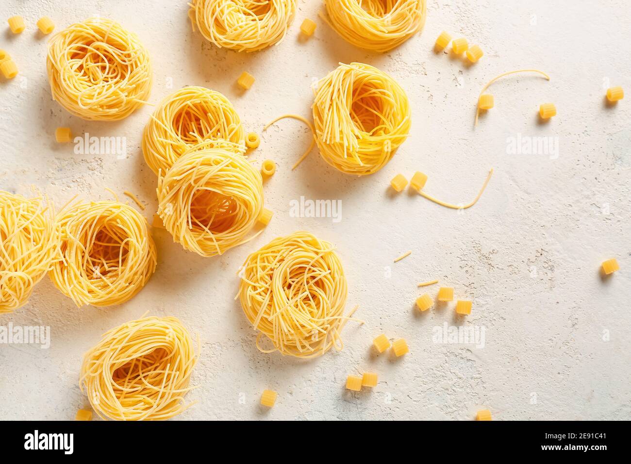 Dry pasta on white background Stock Photo - Alamy