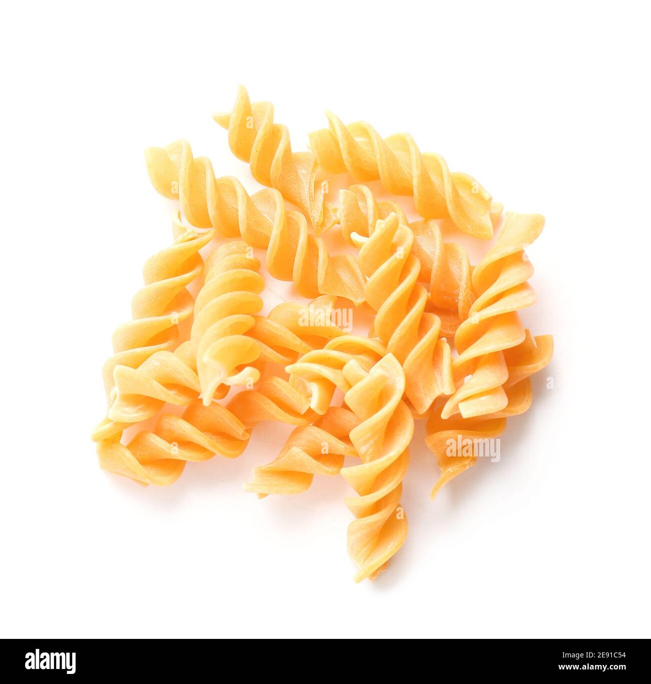 Dry fusilli pasta on white background Stock Photo - Alamy