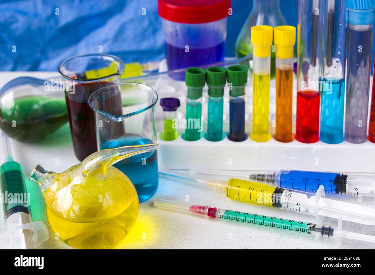 Set of laboratory instruments with glassware, reagents, and colorful ...