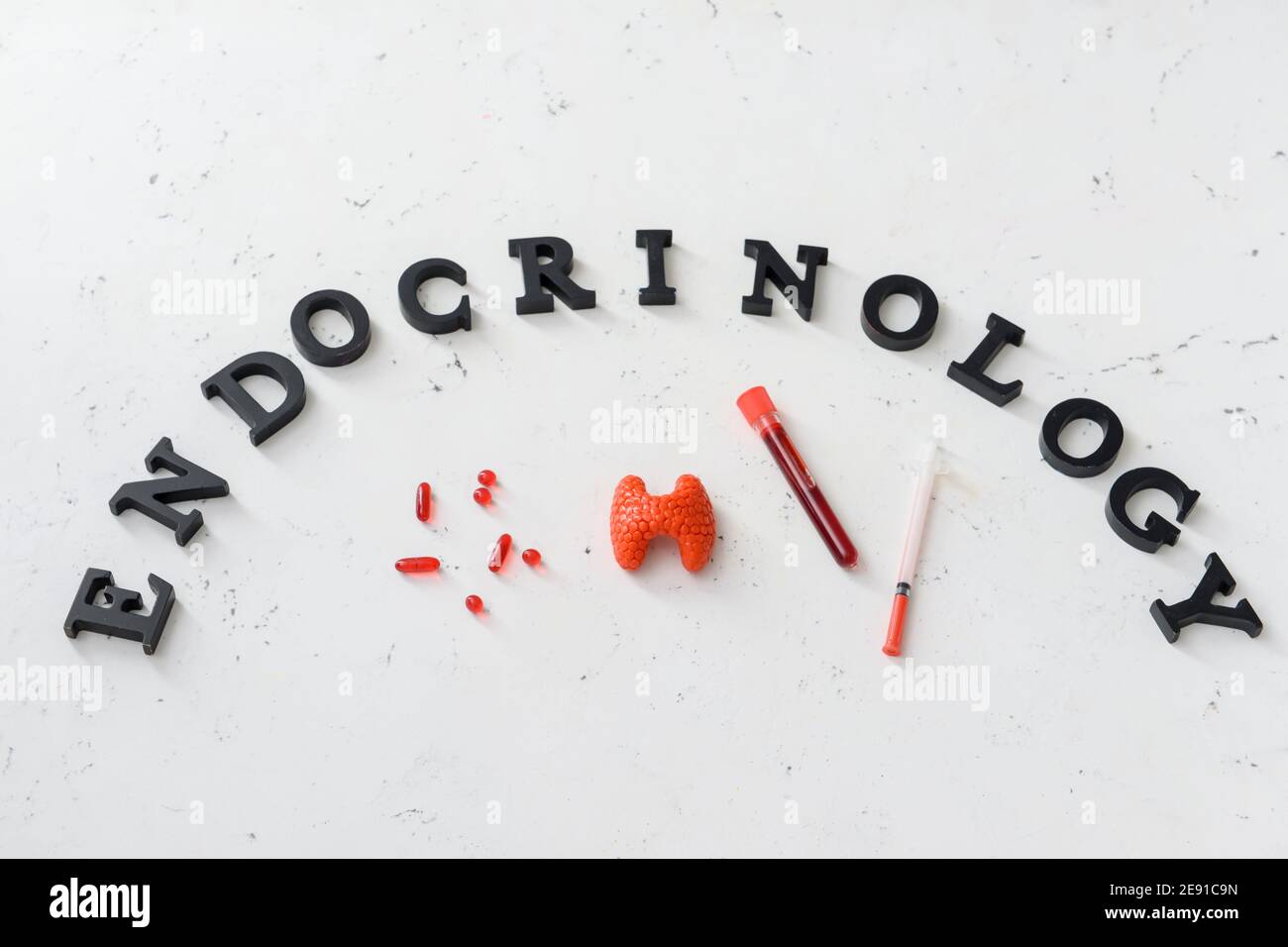 Word ENDOCRINOLOGY, blood sample, syringe and pills on white background ...
