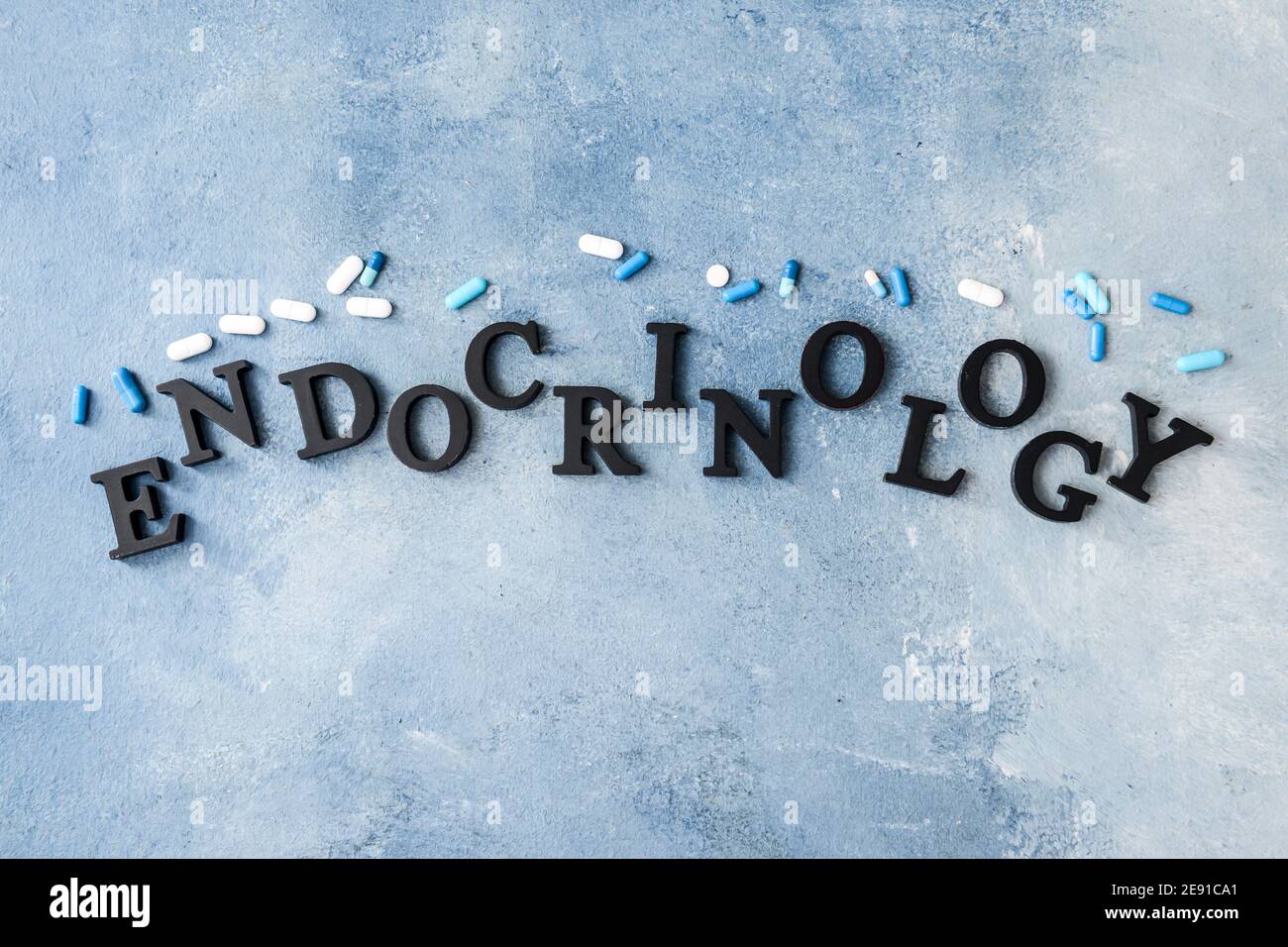 Word ENDOCRINOLOGY and pills on color background Stock Photo - Alamy