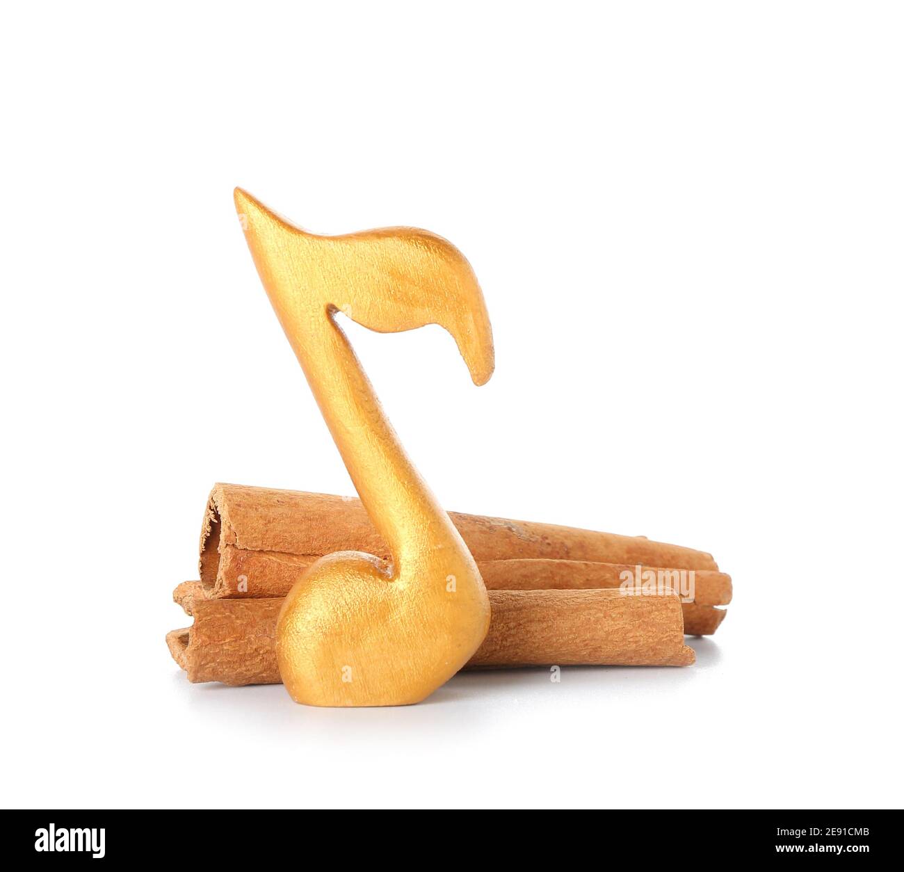 Music note and cinnamon on white background Stock Photo - Alamy