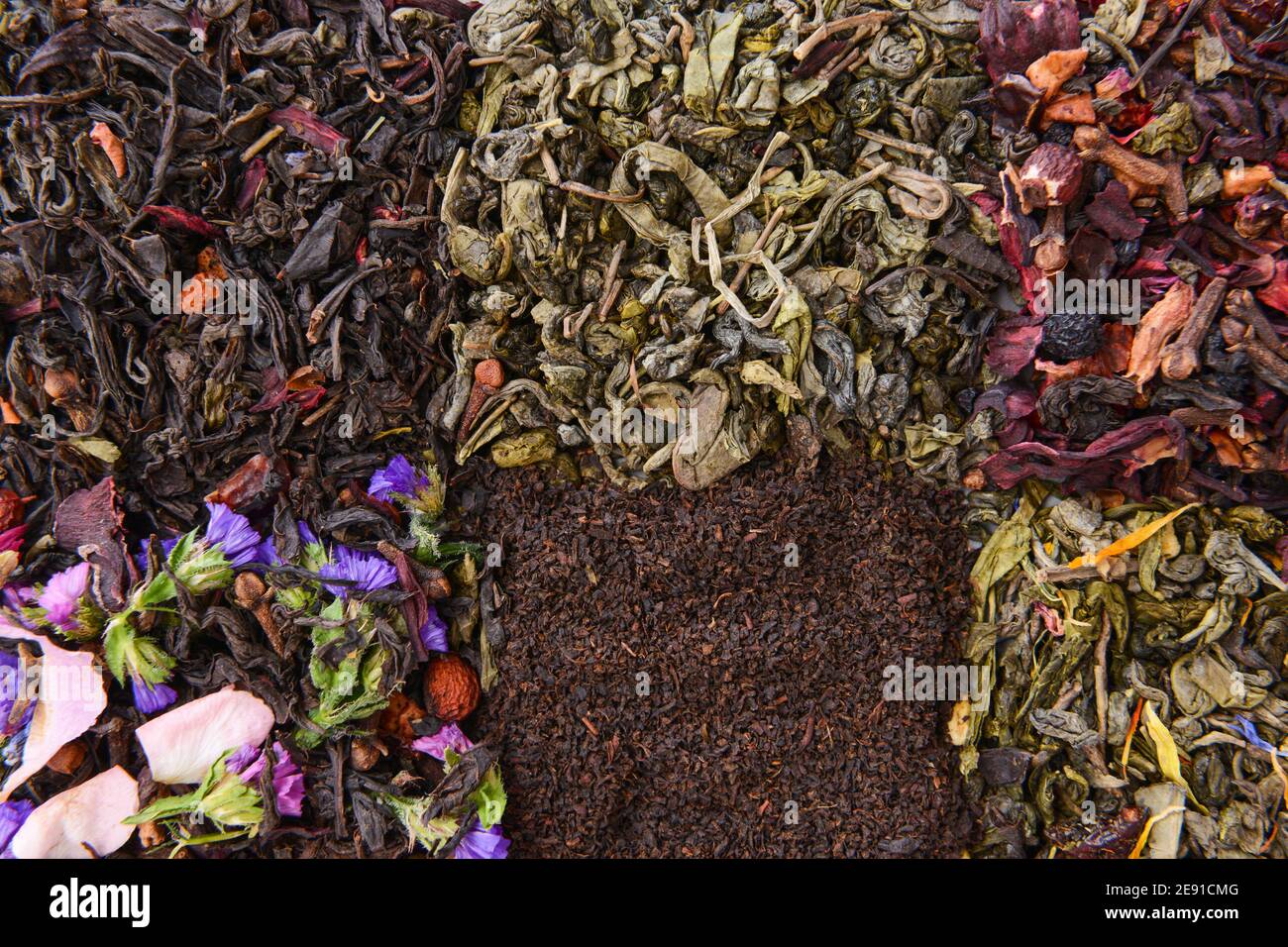 Dry tea leaves and flowers as background Stock Photo - Alamy