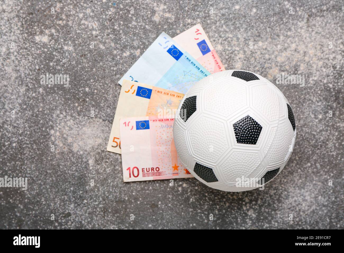 Money and soccer ball on grunge background. Concept of sports bet Stock ...